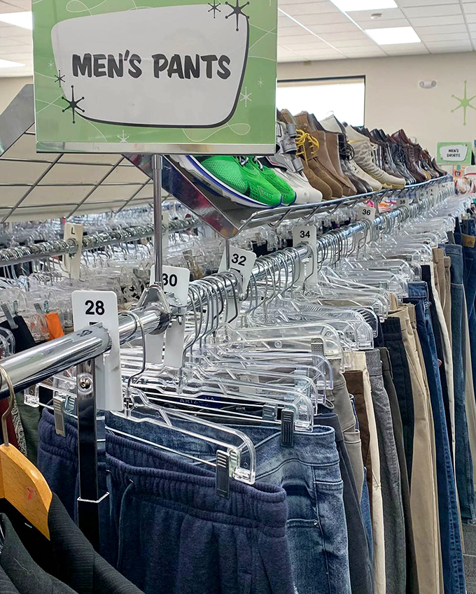 Men's pants organized by size—a rare luxury in thrift shopping that eliminates the usual archaeological dig through random racks.
