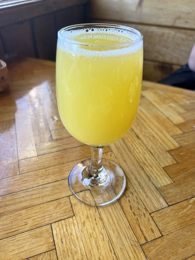 Morning sunshine in a glass—this orange juice so fresh and vibrant it makes you wonder if they're hiding an orange grove somewhere.