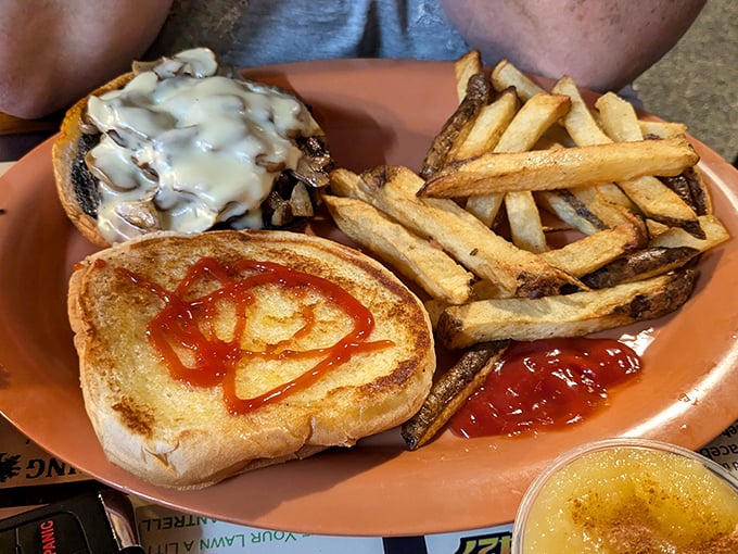 When land calls instead of sea, the mushroom Swiss burger answers with melty cheese cascading over sautéed mushrooms. Those hand-cut fries aren't just a side—they're co-stars.