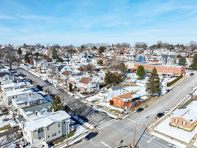 A patchwork quilt of homes spreads across Conshohocken under winter's blanket, each roof sheltering its own unique story.