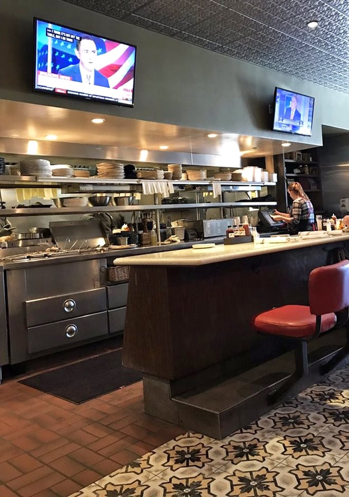 Where the magic happens – Gus's open kitchen lets you witness the choreography of smoke, fire, and skill that transforms ingredients into edible art.