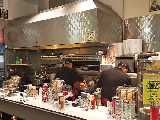 The open kitchen reveals the choreography of short-order cooking—a ballet of spatulas and sizzling grills that's been perfected over decades.