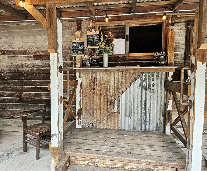 This isn't just an order window—it's a portal to flavor town, framed by weathered wood and western charm.