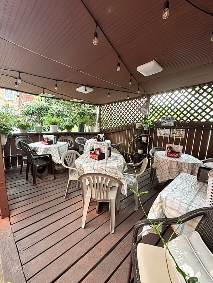 The covered patio feels like dining in your most interesting friend's backyard—if that friend happened to make legendary burgers.