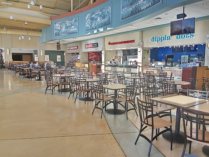 The food court battlefield at rest. These tables have witnessed countless shopping strategy sessions and the unwrapping of victory purchases.