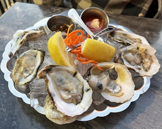 Oysters presented like jewels on ice – briny treasures with lemon and mignonette that taste like kissing the sea itself.