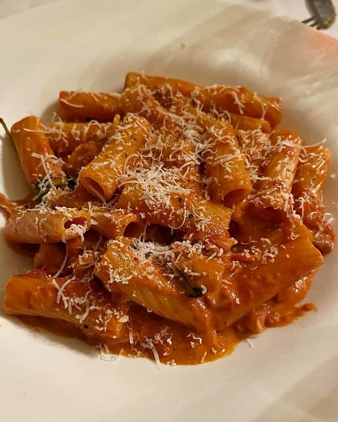 Penne alla vodka that makes you wonder if pasta and tomato cream sauce have been seeing a therapist—their relationship has never been healthier.