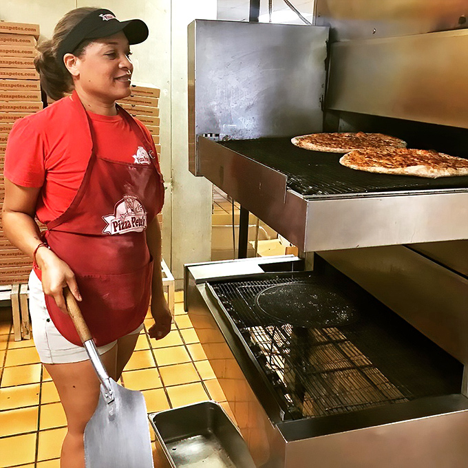 Where pizza dreams come true – watching your creation emerge from the conveyor oven, perfectly baked and ready for its close-up.
