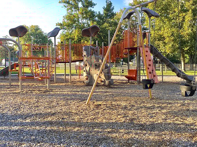 This playground doesn't need flashing lights or smartphone integration—just good old-fashioned climbing structures that have tested generations of young knees.