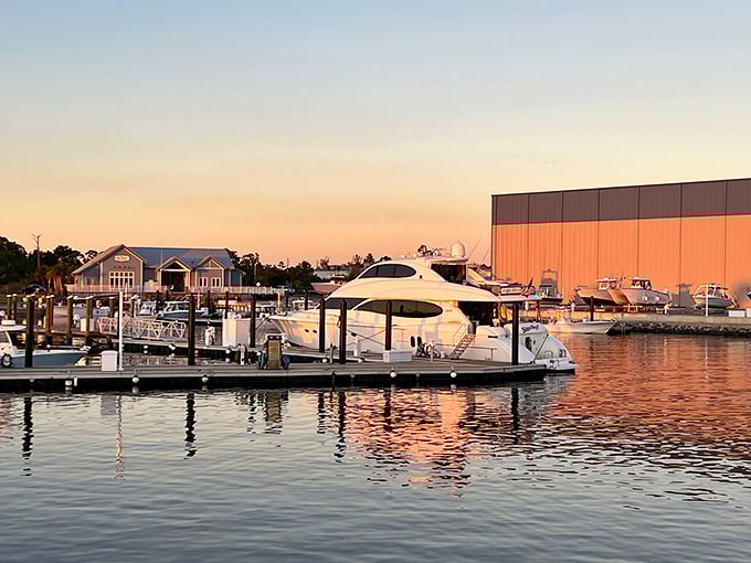 Point South Marina at sunset - where your retirement dreams dock alongside boats you can actually afford.