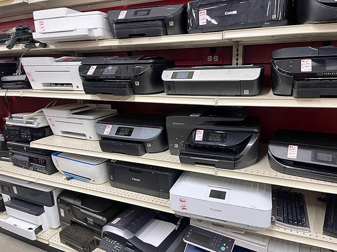 Printers and electronics line the shelves like technological time capsules—yesterday's cutting-edge gadgets awaiting their second chapter.