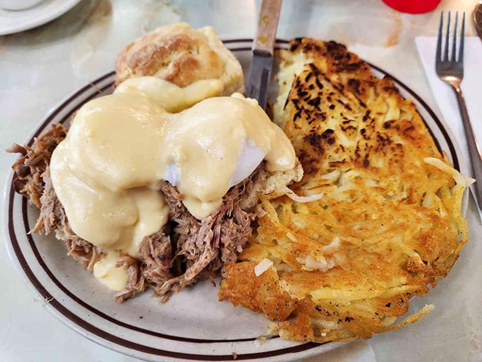 Breakfast meets barbecue in this pulled pork benedict, where slow-cooked meat meets crispy potatoes in a marriage blessed by perfectly poached eggs.