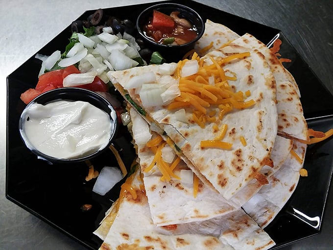 Quesadillas that achieve the golden ratio of cheese pull to tortilla crunch. The accompanying salsa and sour cream are not optional—they're essential supporting characters.