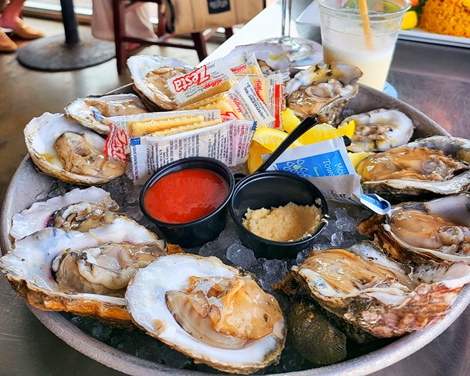 These oysters aren't just served—they're presented on a throne of ice, royal treasures from the deep awaiting their lemon crown.
