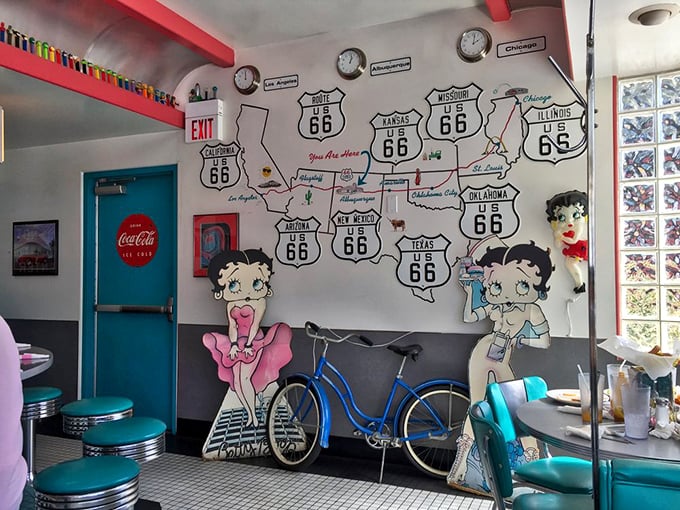 A wall that tells the story of America's most famous highway, with Betty Boop and clocks showing it's always time for pie.