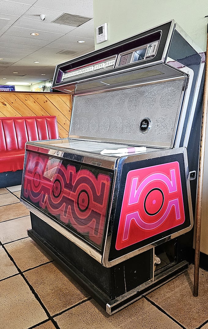 This vintage jukebox stands as a chrome-and-neon reminder that some pleasures—like selecting your breakfast soundtrack—shouldn't be digitized.