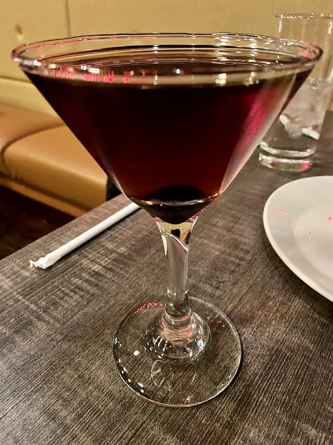 A Manhattan so perfectly balanced it could teach yoga classes—deep ruby red with promises of warmth and sophisticated conversation.