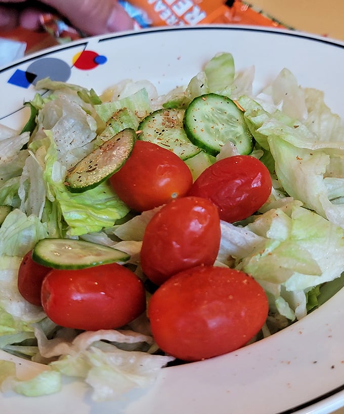Even the simple house salad gets special attention—crisp vegetables providing a fresh counterpoint to all that glorious seafood.