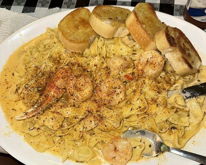 Seafood pasta that doesn't need a fancy Italian name – just plump shrimp, creamy sauce, and garlic bread for sopping up every last heavenly drop.