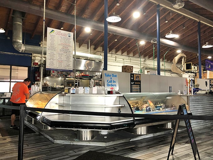 Where the magic happens—fresh seafood displayed like jewels. The "Take Out" sign might be the most dangerous words in Atlantic Beach.