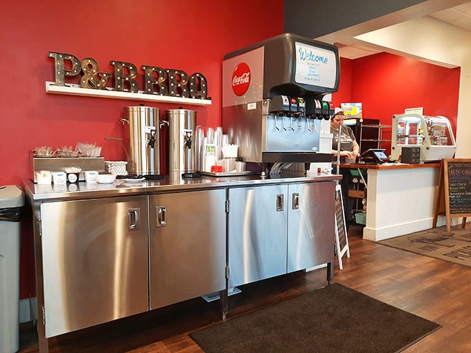That illuminated "BBQ" sign isn't just decoration—it's a beacon of hope for the hungry. The stainless steel service area gleams with promise.