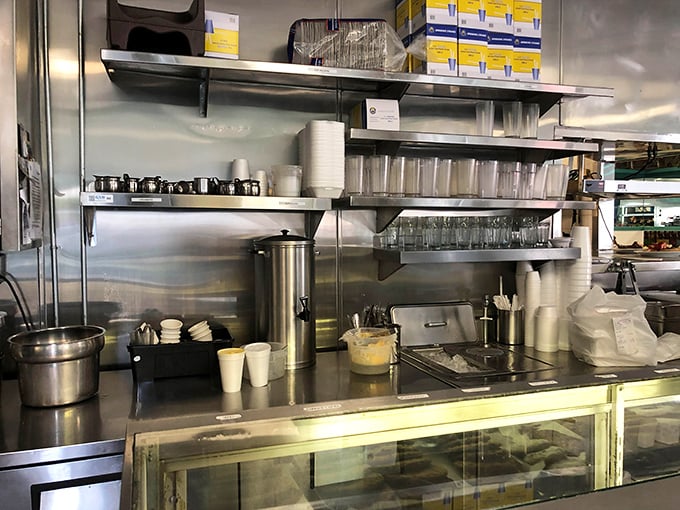 The command center where coffee flows like a caffeinated river and orders dance through the air.