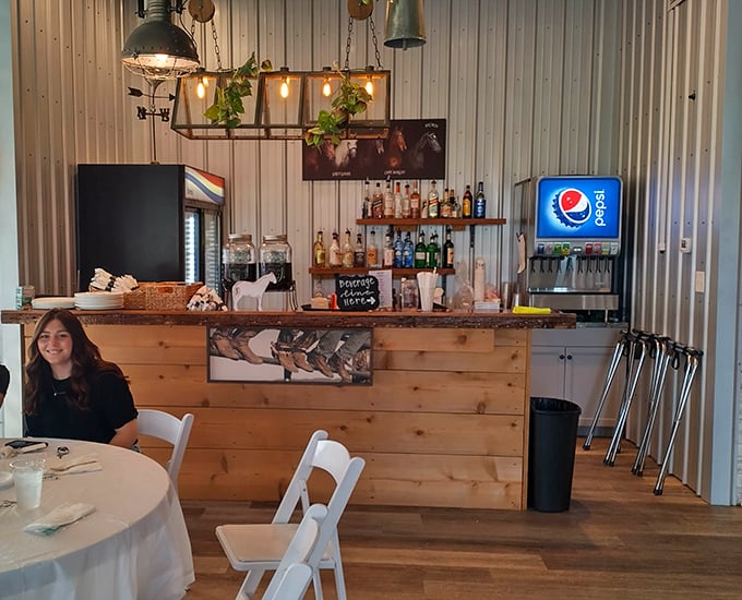 The bar area combines rustic wood with industrial touches – where craft cocktails and local brews await after you've conquered those sirloin tips.