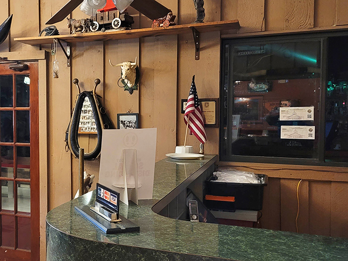 The reception area's Western-themed decor sets the stage for your carnivorous adventure. Saddle up, partner—your steak awaits.