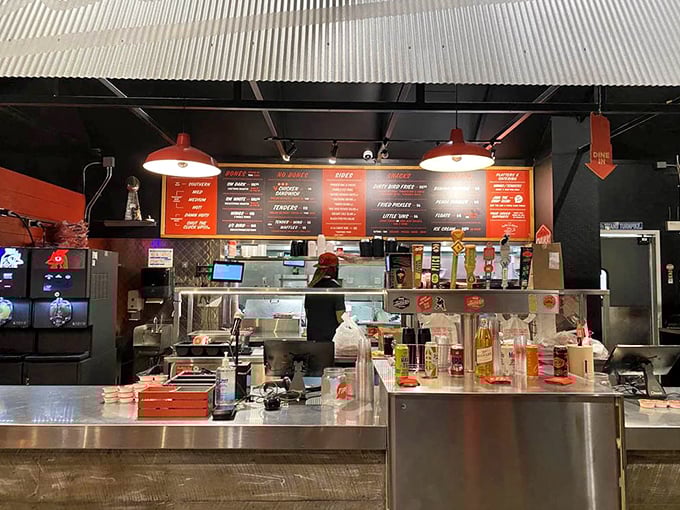 Behind this counter, culinary alchemists transform ordinary chicken into extraordinary Nashville hot magic that keeps people lining up daily.