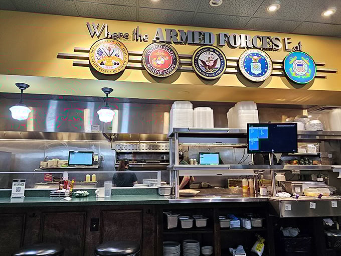 "Where the Armed Forces Eat"—a patriotic tribute above the kitchen that reminds you: heroes have good taste too.