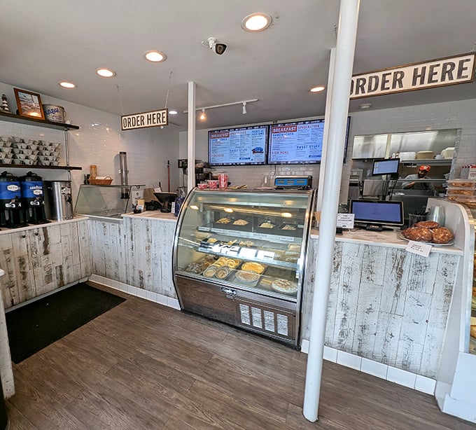 Behind this counter, culinary magic happens daily. The display case offers a tantalizing preview of what might soon be gracing your eager plate.