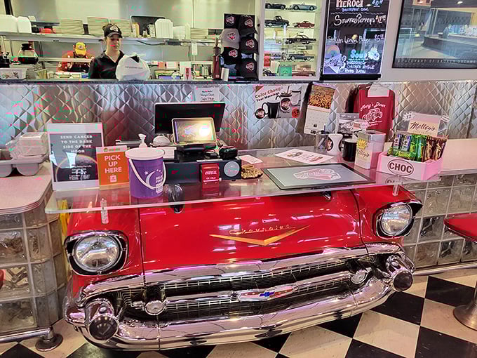 That vintage Chevy front end isn't just a counter—it's automotive history repurposed to serve up slices of pie and nostalgic smiles.