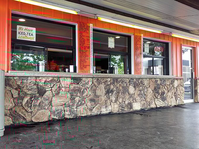 The service windows – where culinary dreams are ordered, assembled, and passed through with the efficiency of a well-oiled machine.