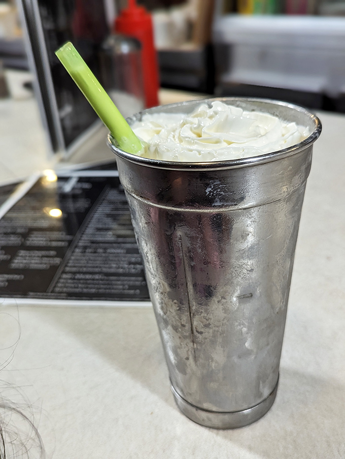 This isn't just a milkshake—it's a frosty masterpiece topped with whipped cream and served with a celery stick garnish because... Pennsylvania.