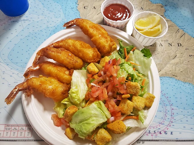 Jumbo shrimp and fresh salad—for when you want to feel virtuous while still indulging in golden-fried ocean treasures. The seafood equivalent of having your cake and eating it too.