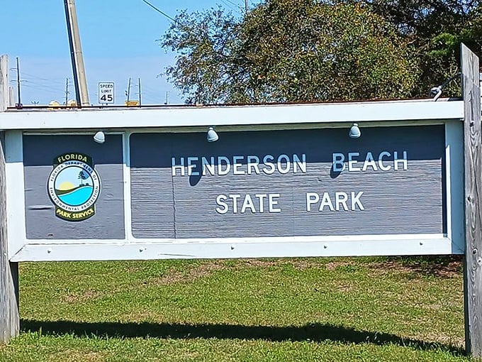 The park's entrance sign welcomes visitors with the simplicity of blue and white—Florida's official colors of "relax, you're here now."