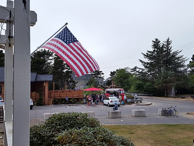 The village center feels like stepping into a Norman Rockwell painting—complete with fluttering flag and the promise of small-town discoveries.