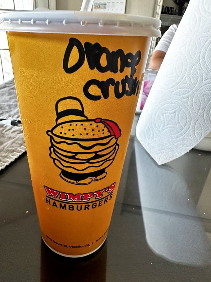 That Orange Crush isn't just a beverage – it's liquid sunshine in a cup with the perfect burger-complementing sweetness.