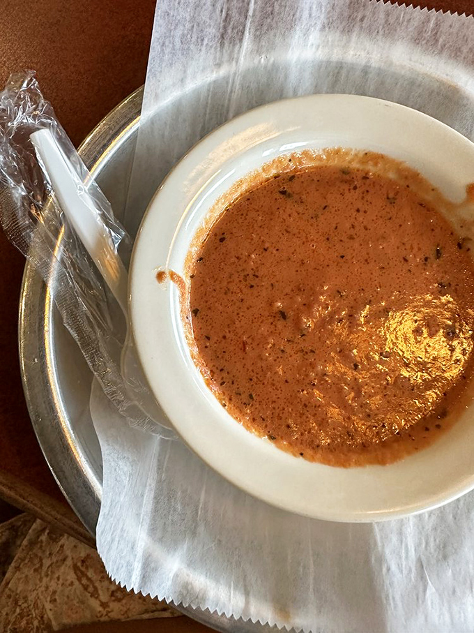 Soup that whispers, "Cancel your plans, stay awhile." The plastic spoon is just a formality—you'll want to drink this directly.