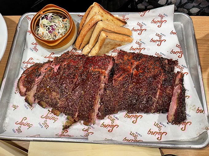BBQ artistry that would make a carnivore weep – these ribs have clearly been on a slow, smoky journey to reach your eager fork.