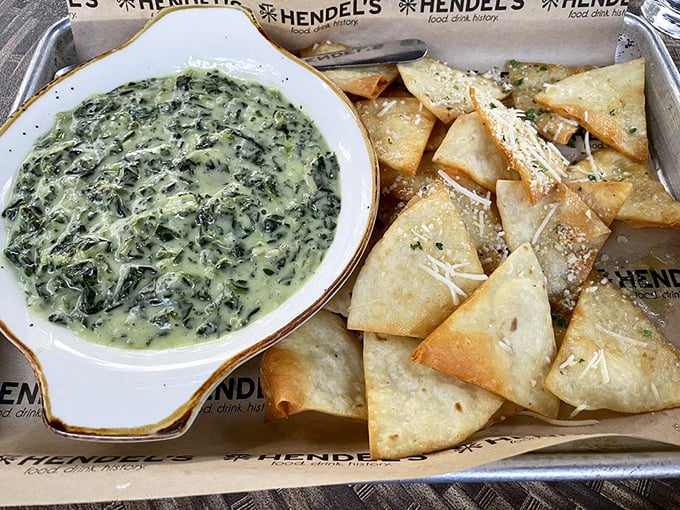 Spinach artichoke dip and crispy pita triangles – the appetizer equivalent of a perfect first date: warm, cheesy, and leaves you wanting more.