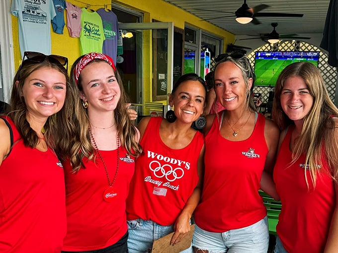 Woody's staff—the red-shirted ambassadors of seafood joy—bringing Delaware beach hospitality to life with every plate served.