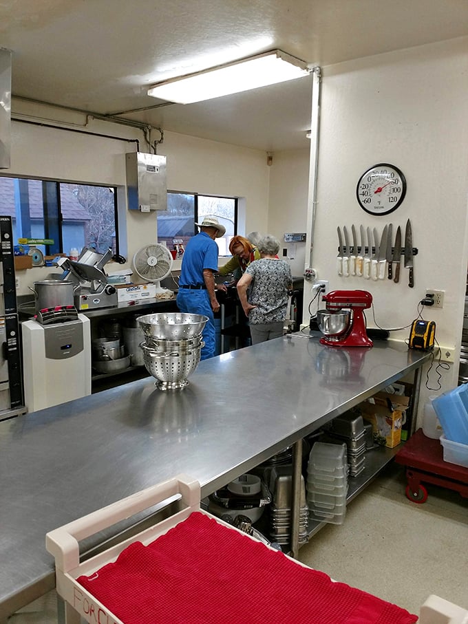 In this kitchen, industrial-sized equipment meets home-cooking care. Those knives on the wall have stories that could fill cookbooks.