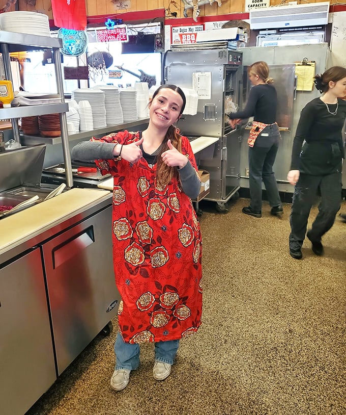 Behind the scenes, the kitchen crew works their magic, turning raw ingredients into the smoky treasures that keep locals and travelers coming back.