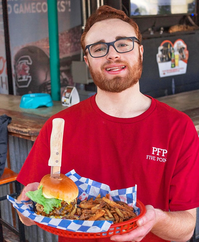 That smile says it all—when your job is delivering happiness on a plate, it's hard not to share in the joy.