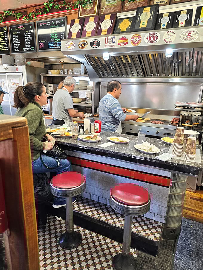 The open kitchen concept wasn't invented by trendy restaurants—diners perfected it decades ago, making every meal dinner and a show.