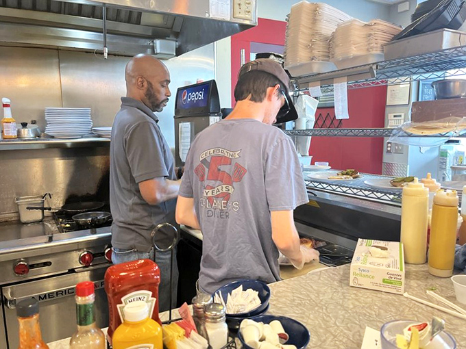 Where the magic happens—skilled hands working the grill with the precision of orchestra conductors. Breakfast is serious business here.