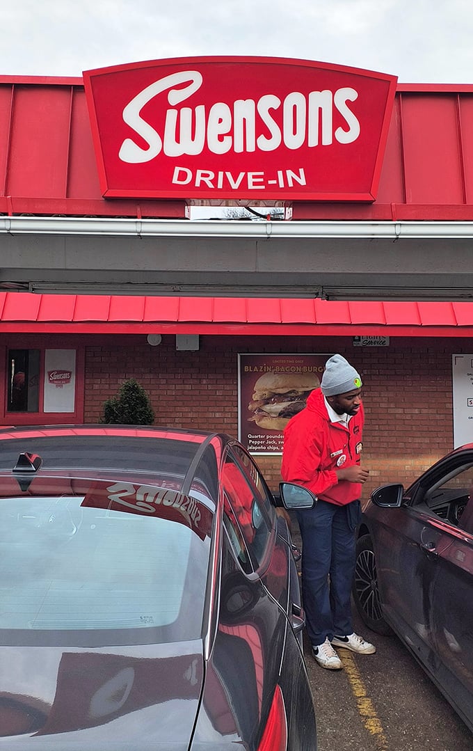 The curb hop sprints between cars with the urgency of an Olympic athlete—because great burgers wait for no one.