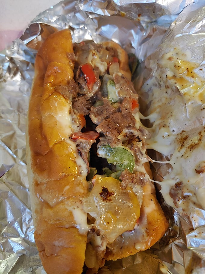 The Steak Philly—where thinly sliced beef meets melted cheese in a relationship your cardiologist warned you about but your soul needs.