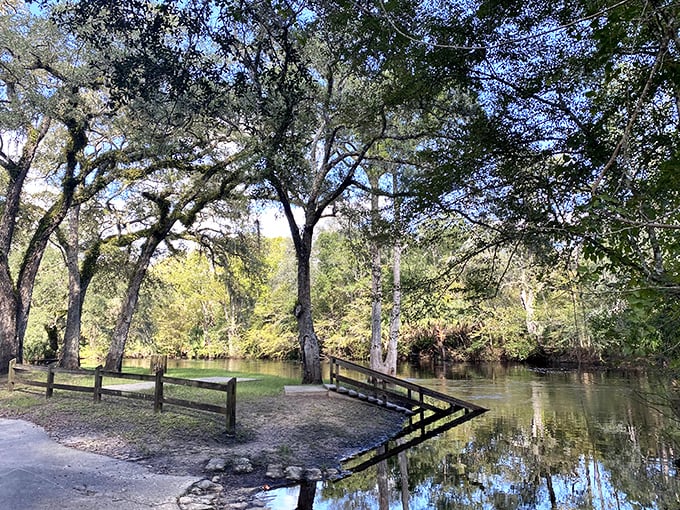 A peaceful riverside park where the water's gentle flow matches the town's unhurried pace – nature's meditation space, no app required.